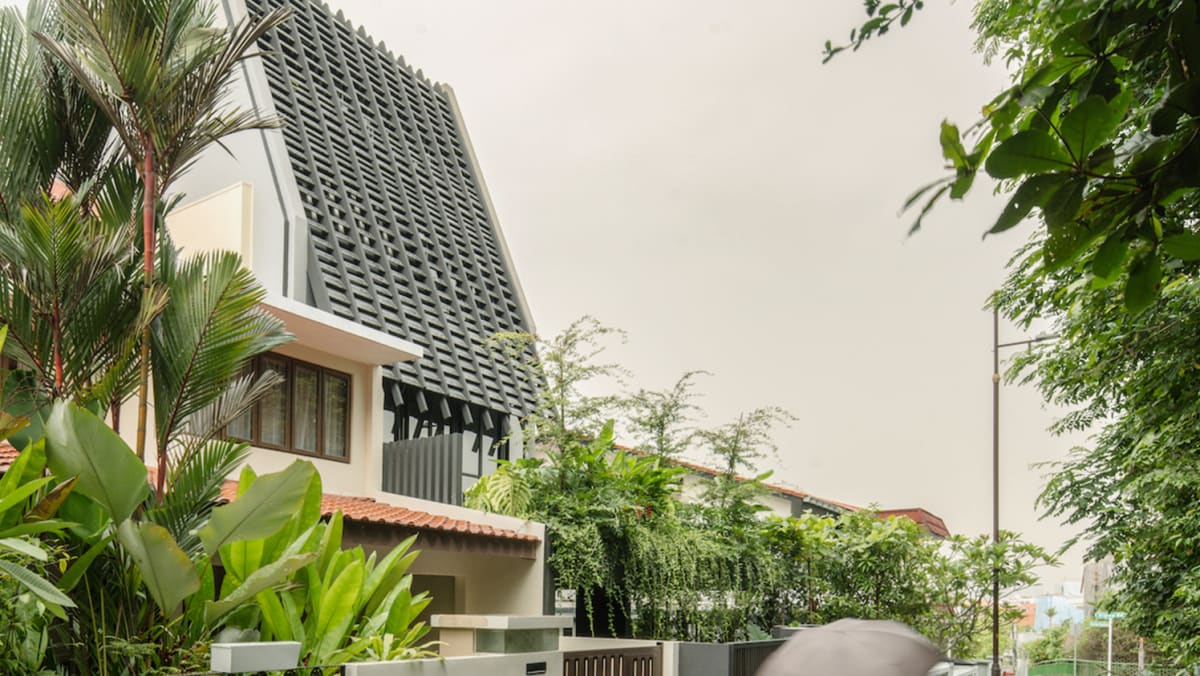 A 4-storey home with an uncommon, slanted roof and facade